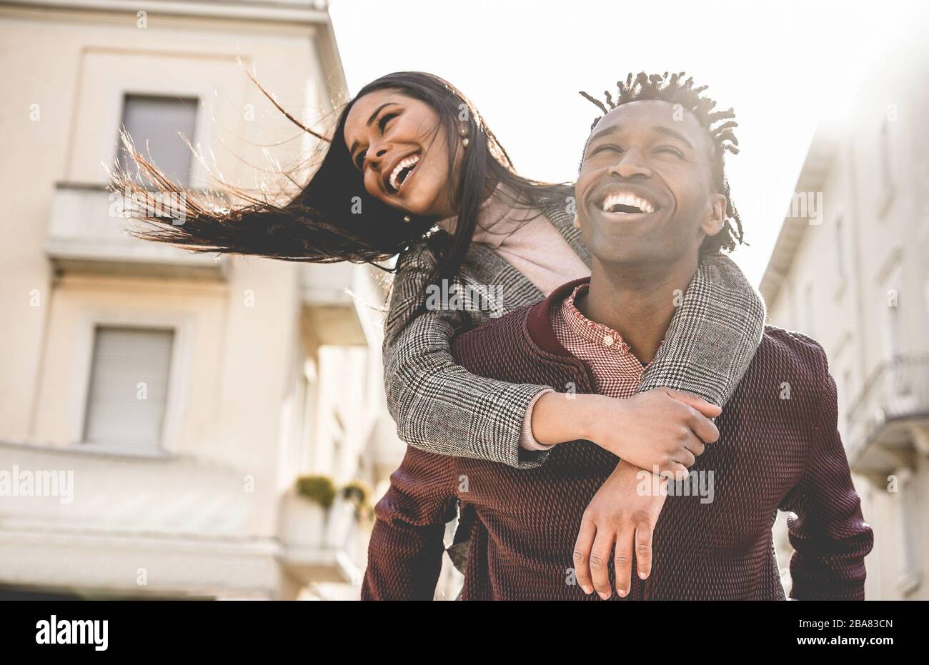 African couple having fun outdoor in city tour - Young people lovers ...