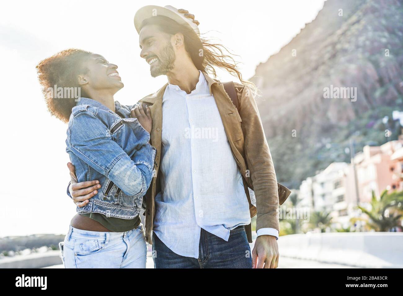 Multiracial happy couple having fun together during vacation - Travel ...