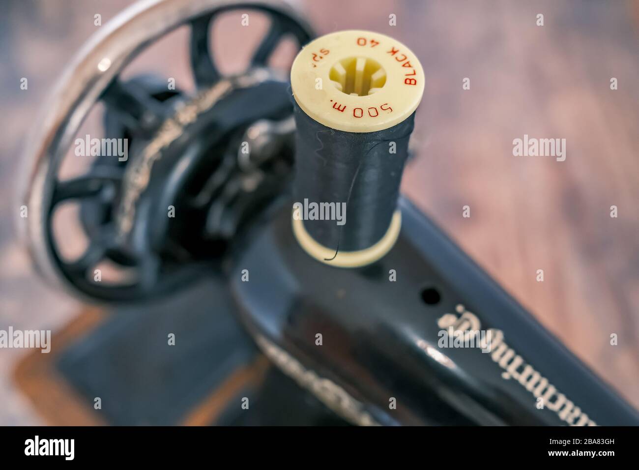 Close up of cotton reel on a sewing machine hi-res stock photography ...
