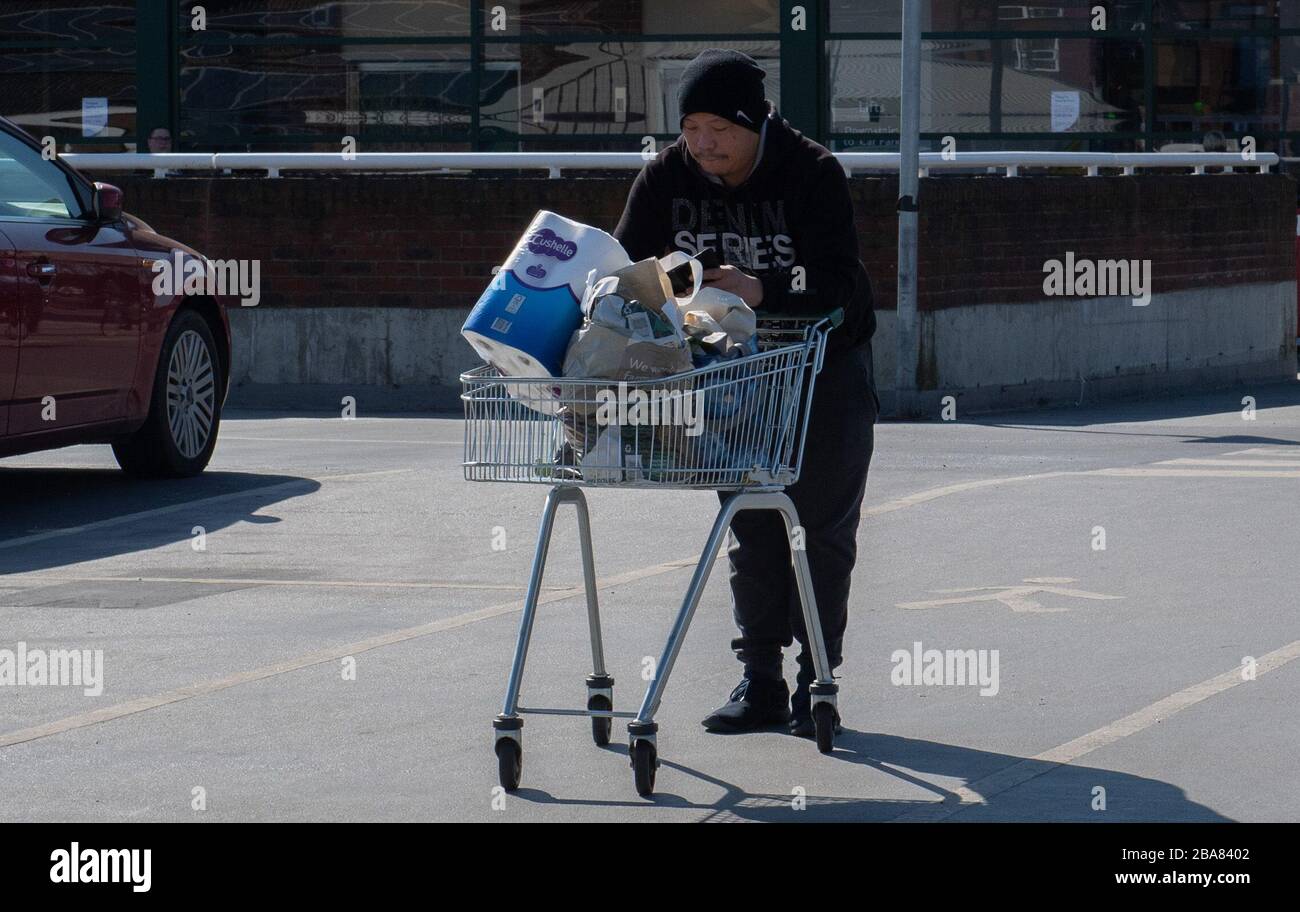 Sidcup, UK. 25th Mar, 2020. Shoppers outside Morrisons in Sidcup, Kent ...