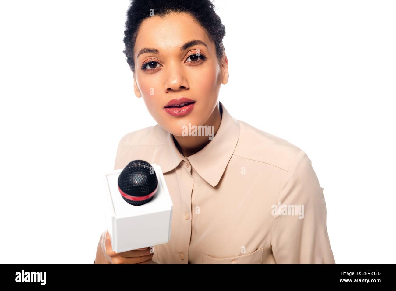 Portrait of african american journalist with microphone looking at ...