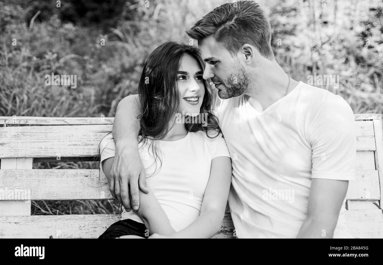 Couple sit bench Black and White Stock Photos & Images - Alamy