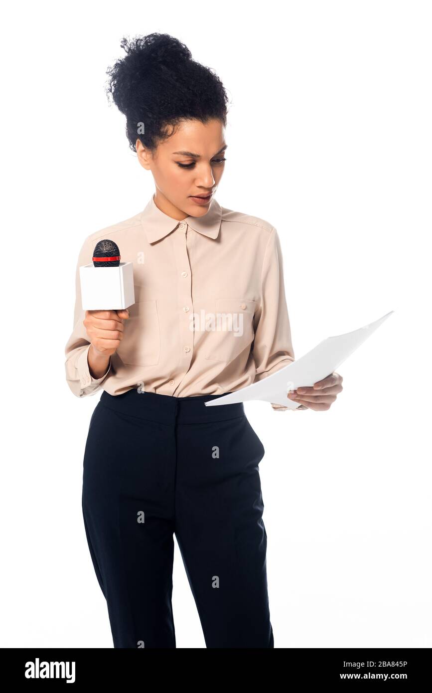 Front view of concentrated african american journalist with microphone ...