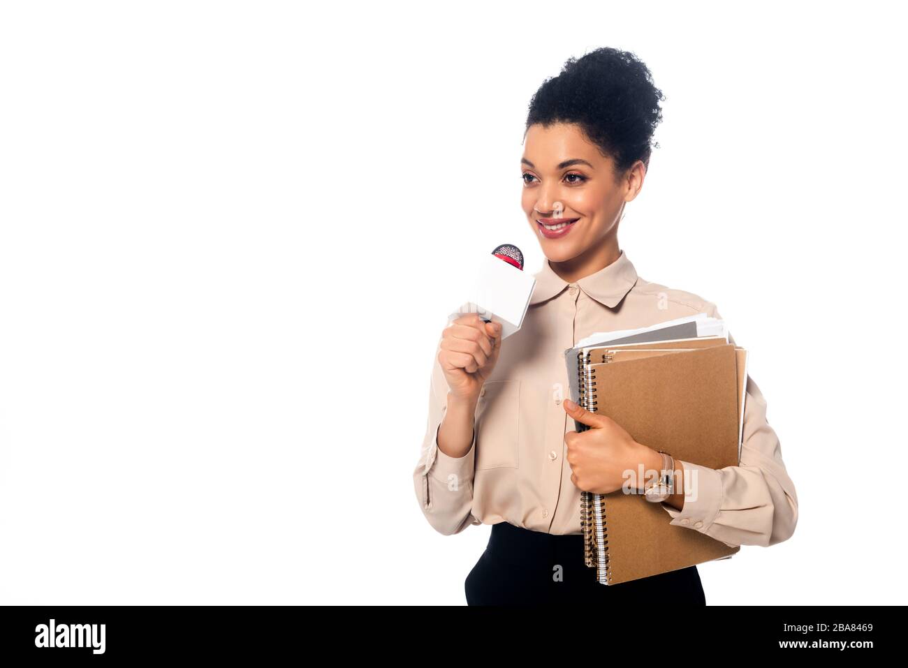 African american journalist with microphone, documents and notebooks ...