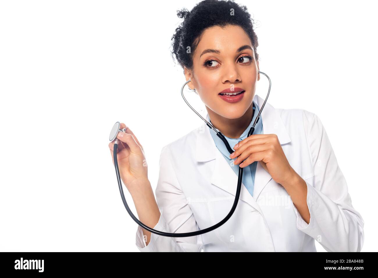 African american doctor listening with stethoscope isolated on white ...