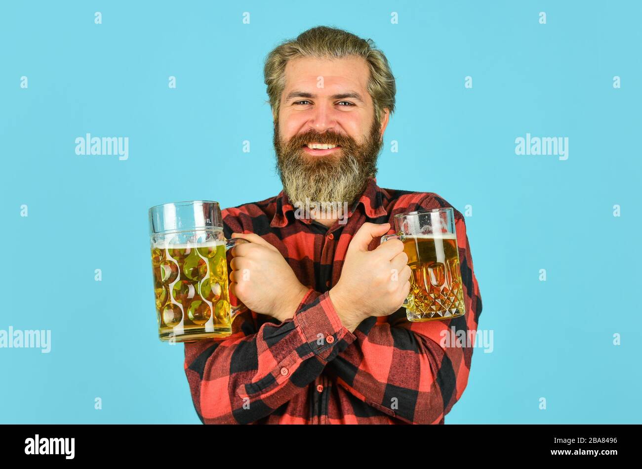 Hipster drink beer. Mature bearded guy hold beer glass. Cheers toast ...