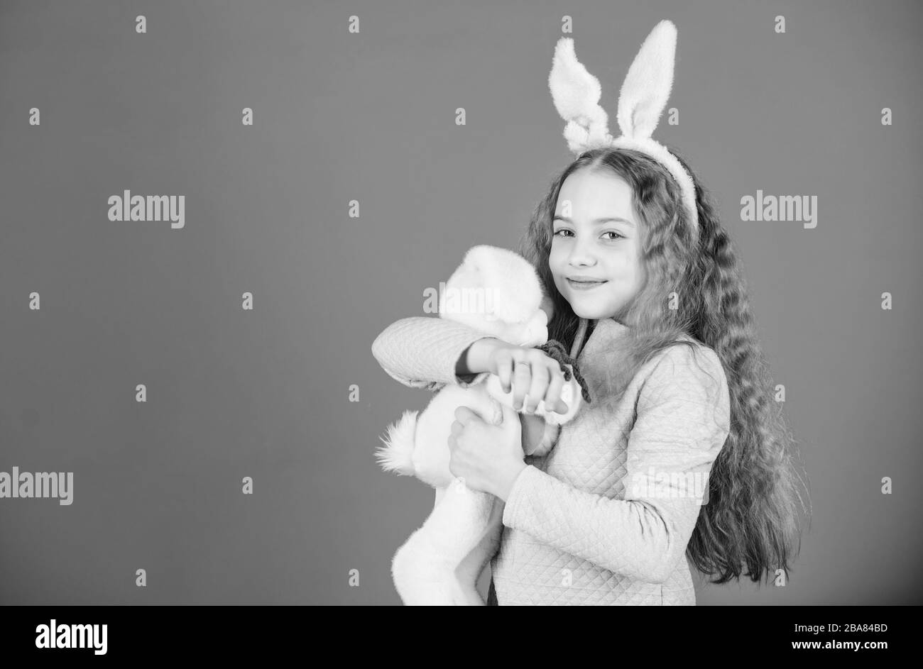 Cute and adorable. Bunny girl with cute toy on blue background. Child ...