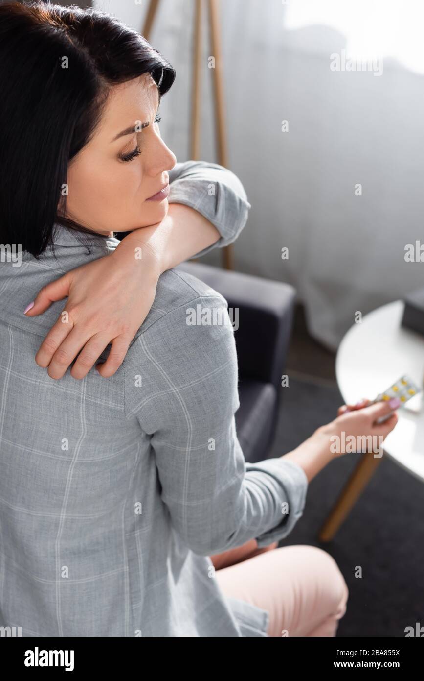Woman scratch back hi-res stock photography and images - Alamy