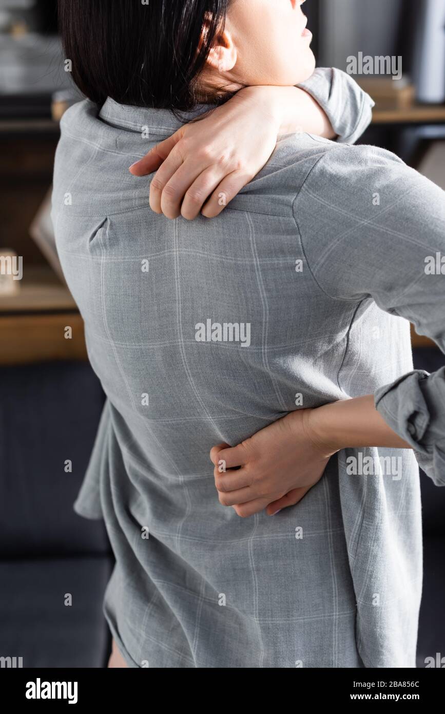 Woman scratch back hi-res stock photography and images - Alamy