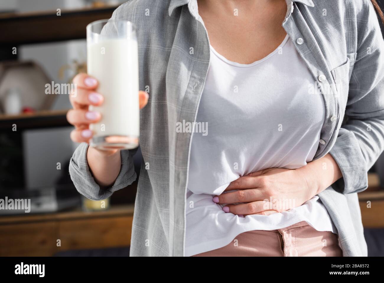 Woman stomach ache milk hi-res stock photography and images - Alamy