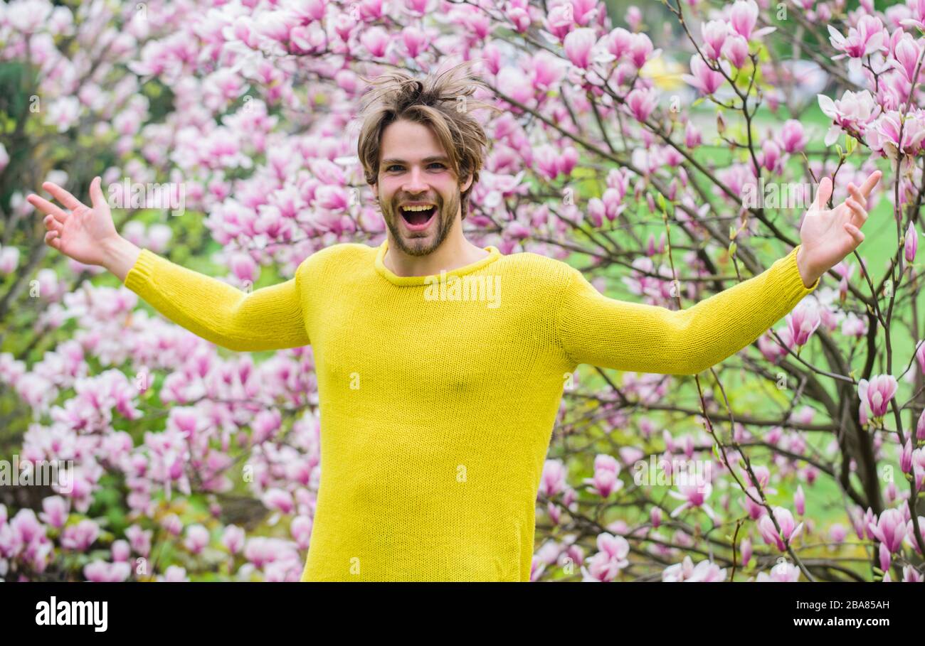 Happy spring concept. Hipster enjoy blossom aroma. Spring season ...