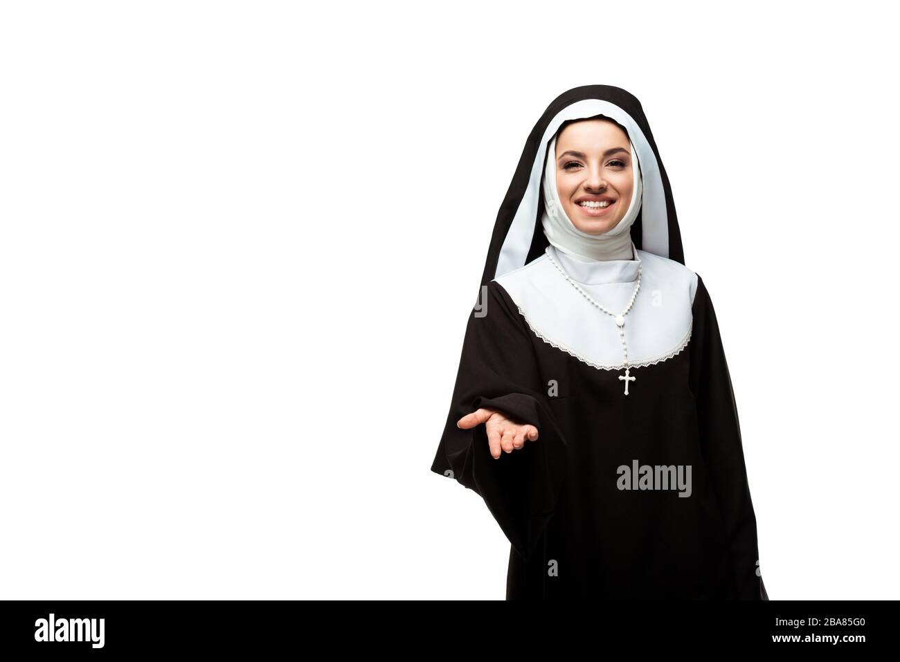 beautiful smiling nun in black clothing reaches out hand, isolated on ...