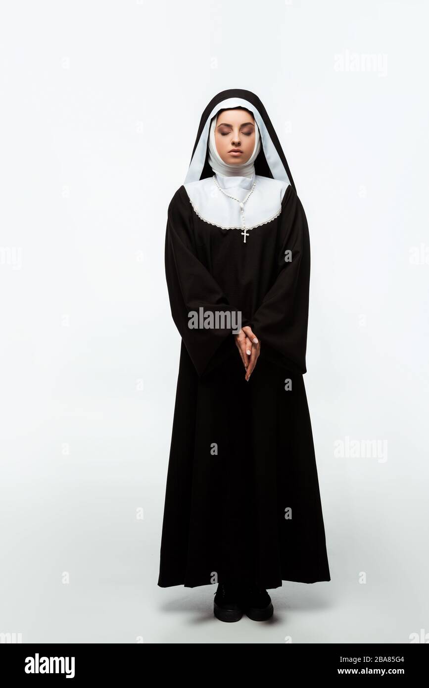 beautiful nun praying with closed eyes, isolated on white Stock Photo ...