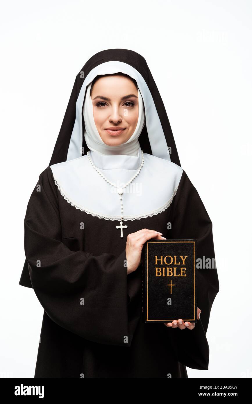 smiling nun holding holy bible isolated on white Stock Photo - Alamy