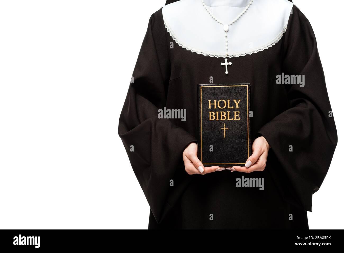 cropped view of nun holding holy bible isolated on white Stock Photo ...