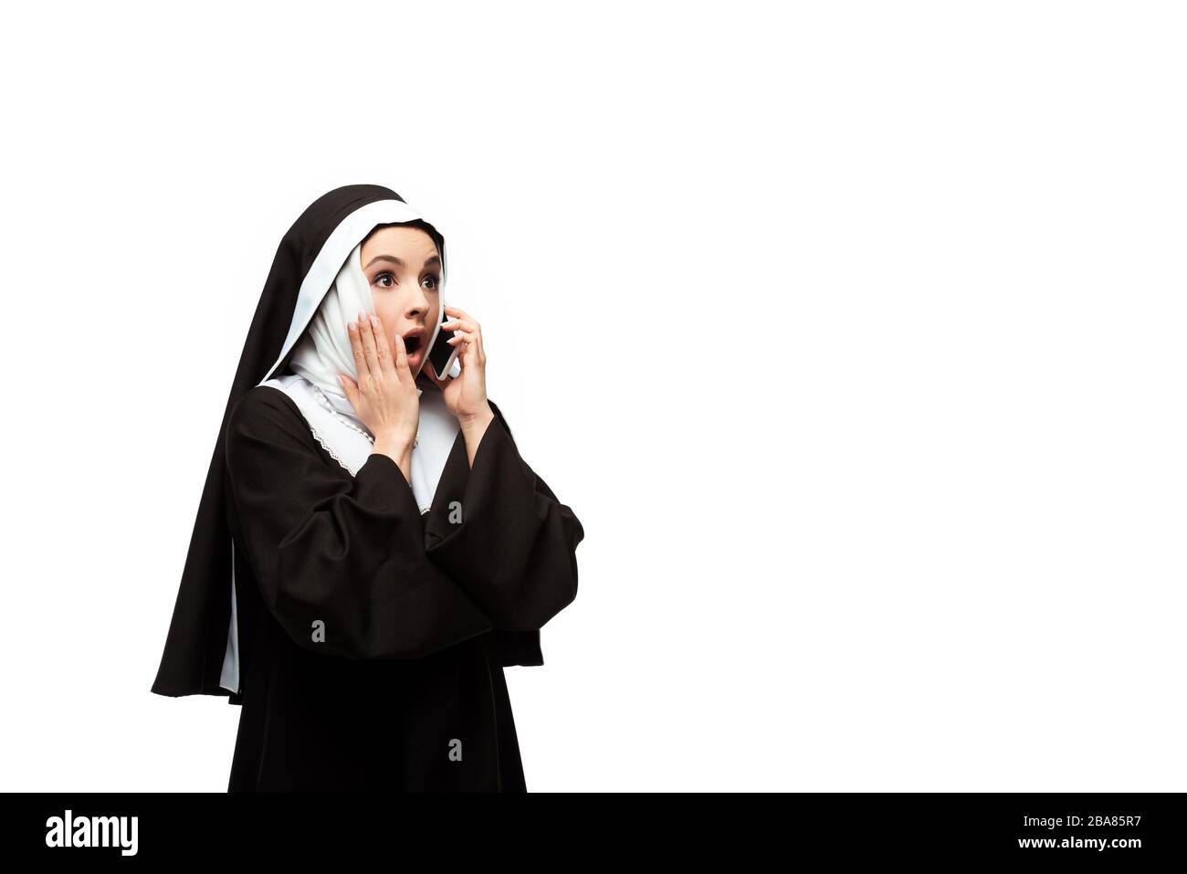 surprised nun talking on smartphone isolated on white Stock Photo - Alamy