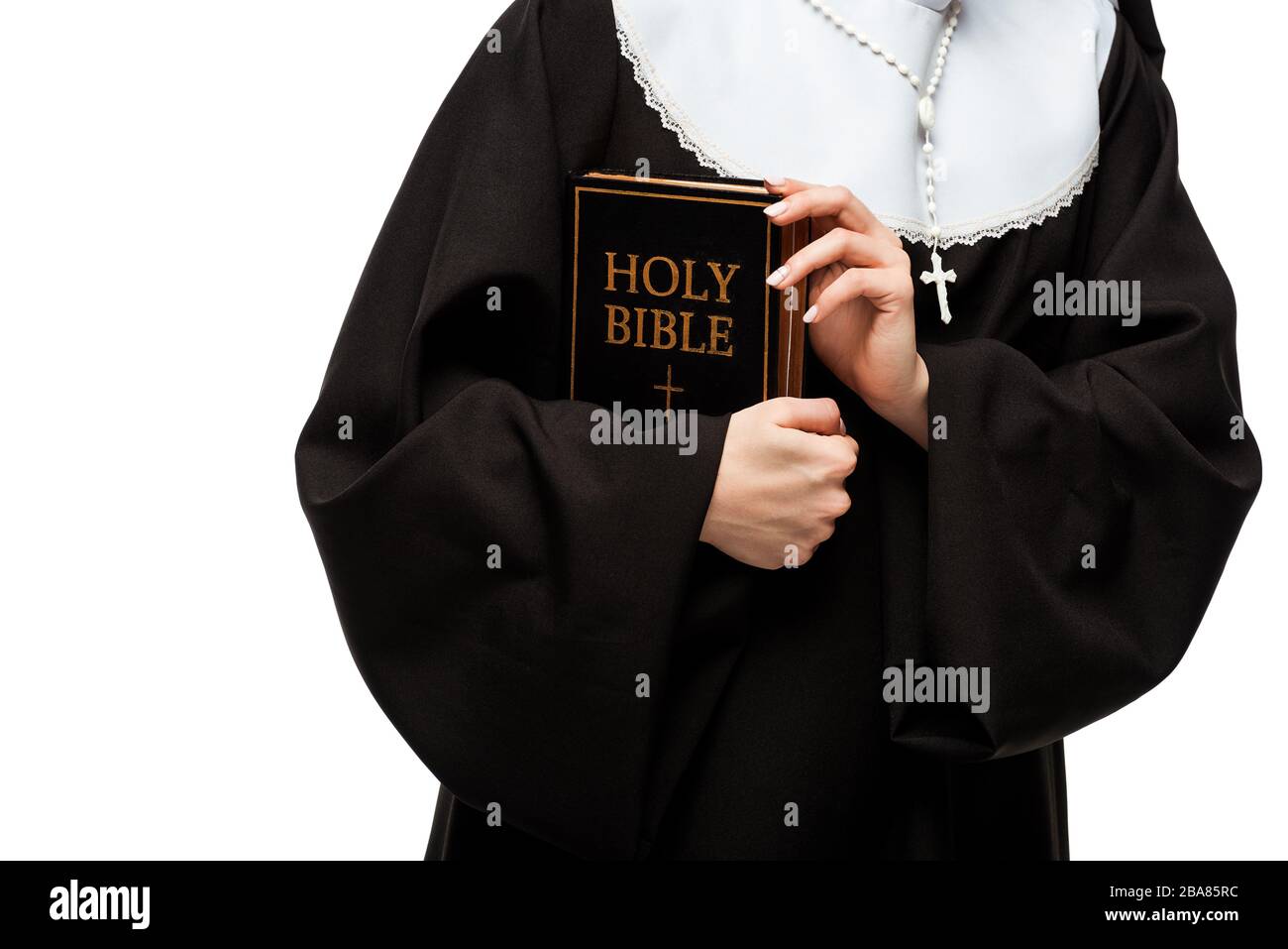 cropped view of nun holding holy bible isolated on white Stock Photo ...