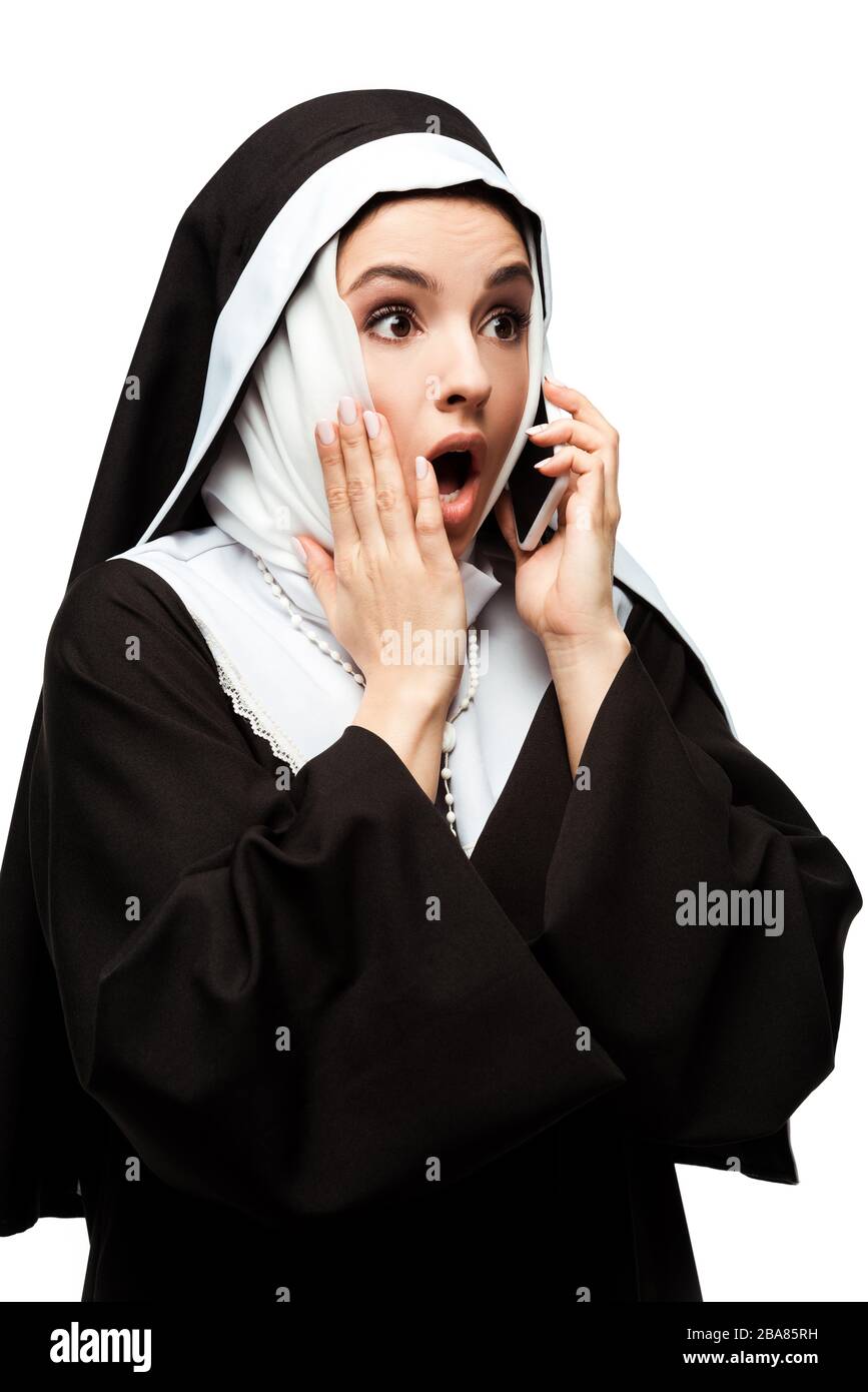 Beautiful Shocked Nun Talking On Smartphone Isolated On White Stock