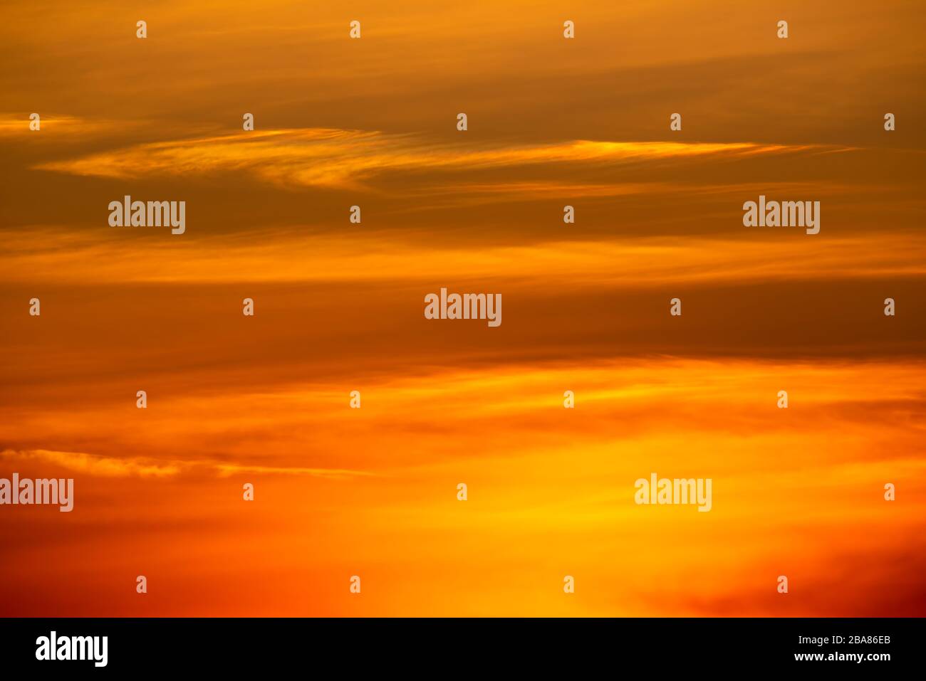 Beautiful golden sunset sky with clouds Stock Photo - Alamy