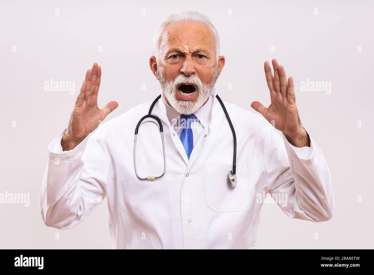 Image of angry senior doctor shouting on gray background Stock Photo ...