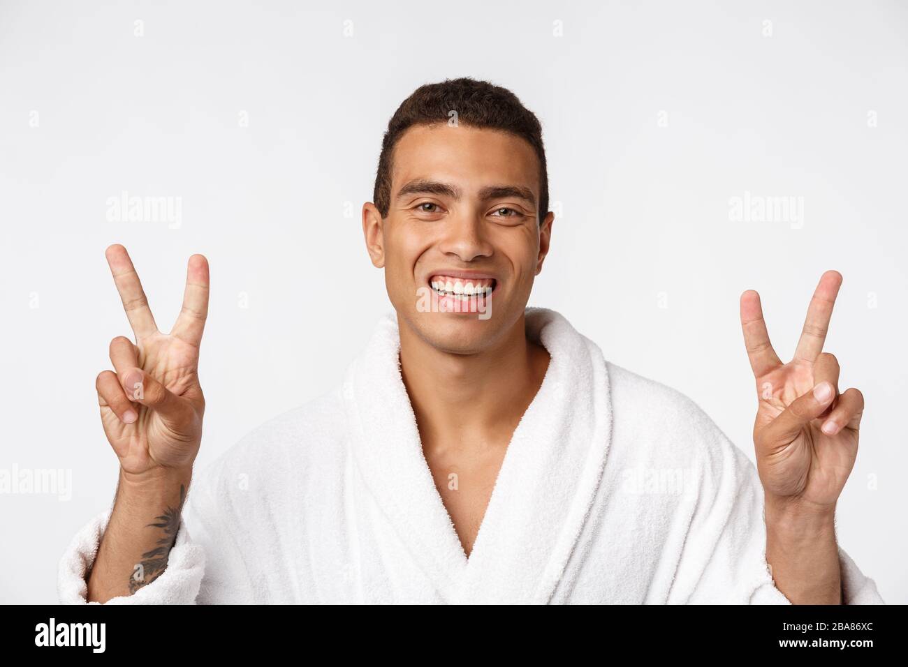 Closeup portrait happy, excited, successful young man giving peace ...