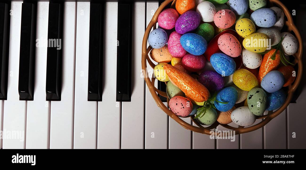 Colorful Paschal Easter Eggs and Piano Keys Stock Photo - Alamy