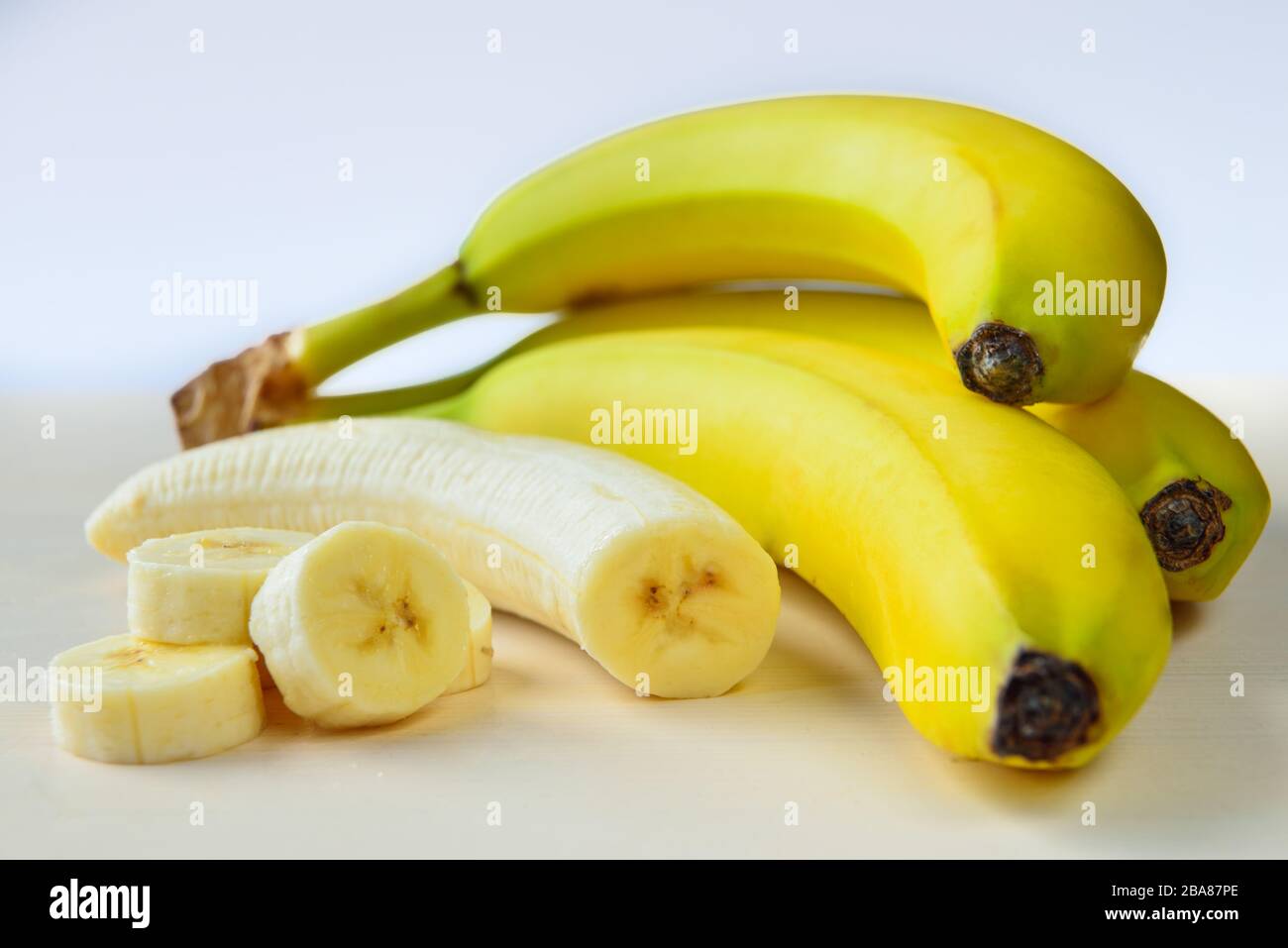Cut bananas on a cutting board Stock Photo - Alamy