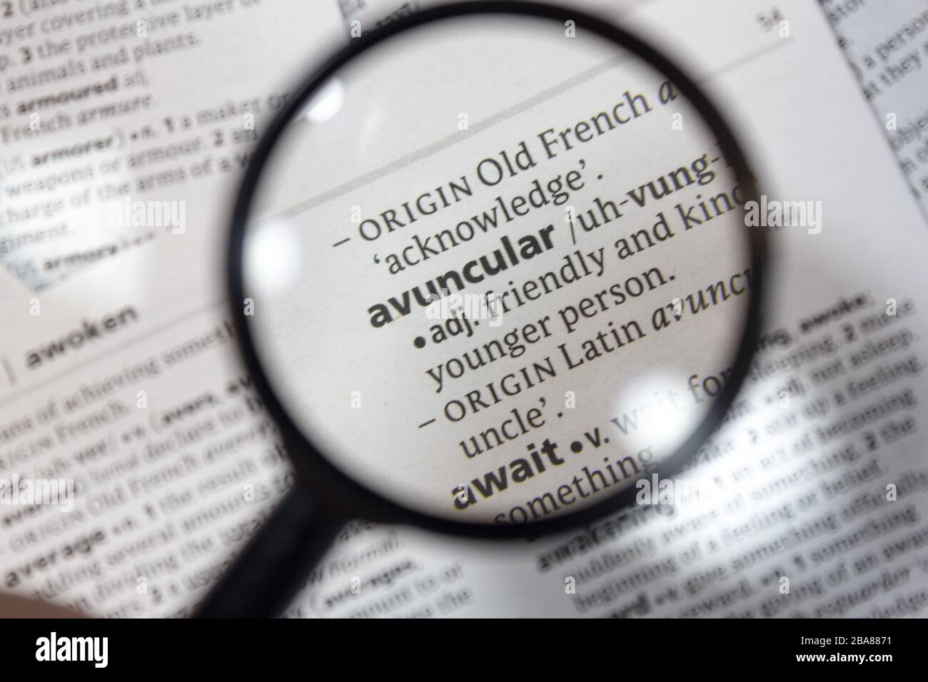 The word of phrase avuncular in a dictionary Stock Photo - Alamy