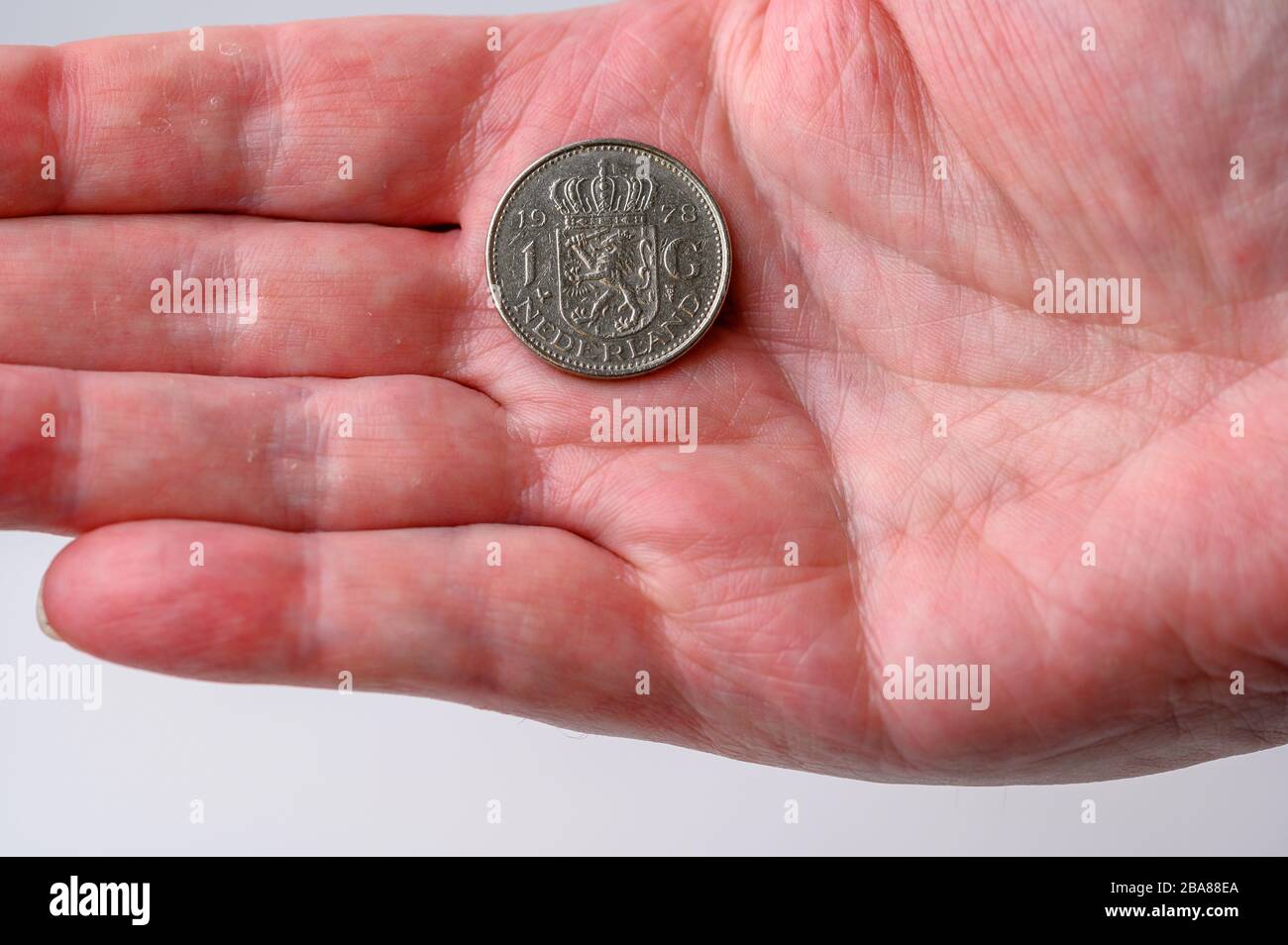 Netherlands, dutch guilder in the hand, change from shopping Stock ...