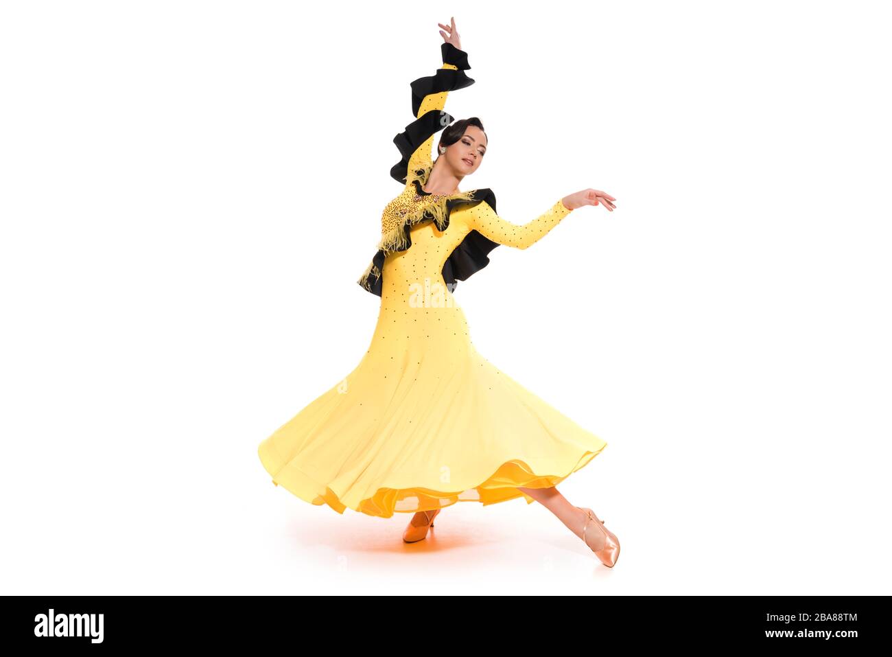 elegant young ballroom dancer in yellow dress dancing on white Stock ...