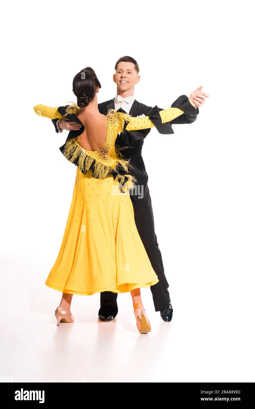elegant young couple of ballroom dancers dancing isolated on white ...