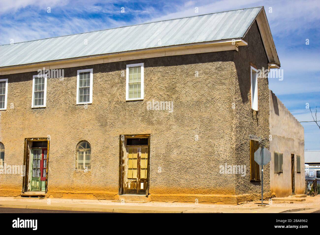 Old Two Story Building With Tin Roof Stock Photo - Alamy