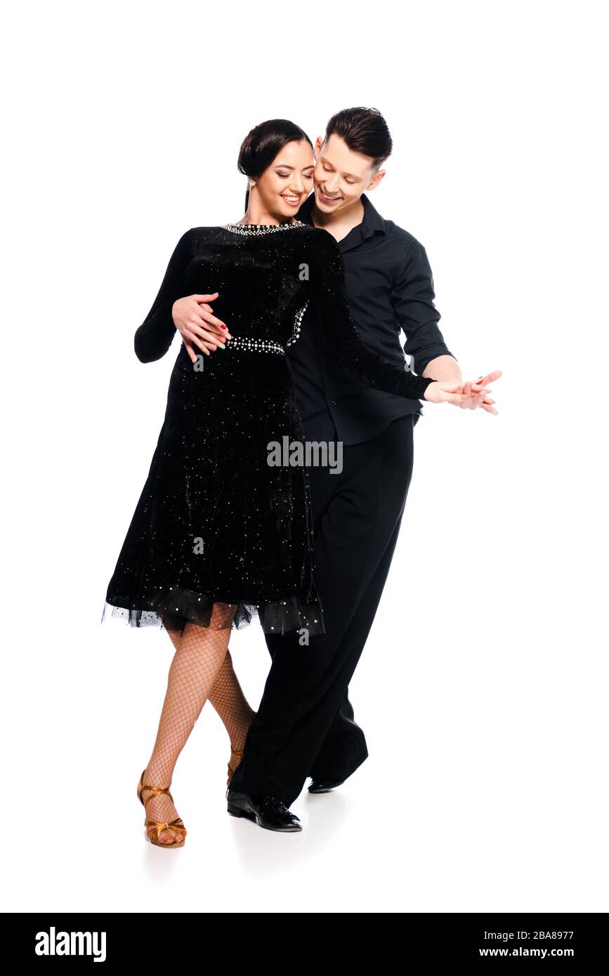 elegant young couple of ballroom dancers in black dress and suit ...