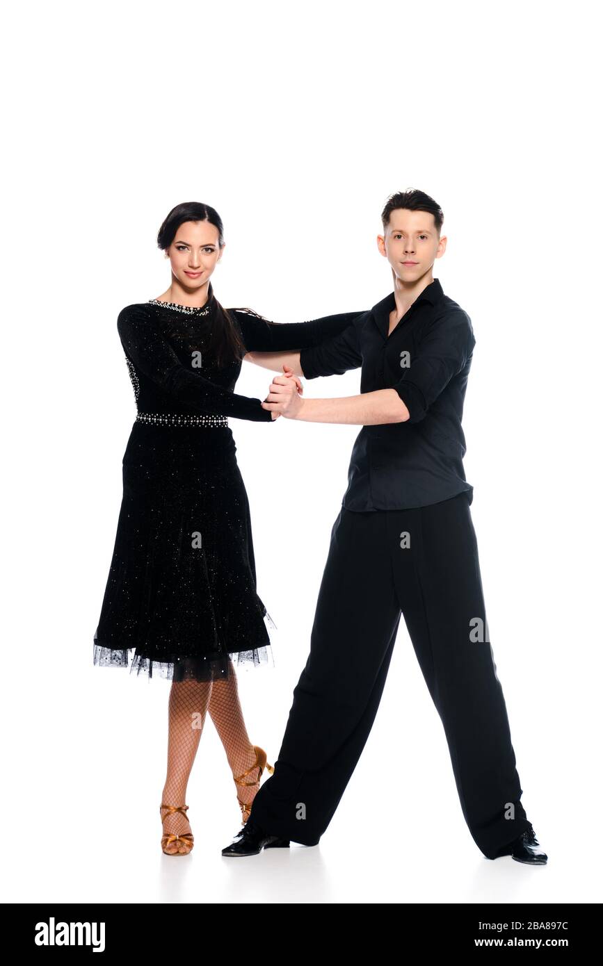 elegant young couple of ballroom dancers in black dress and suit ...