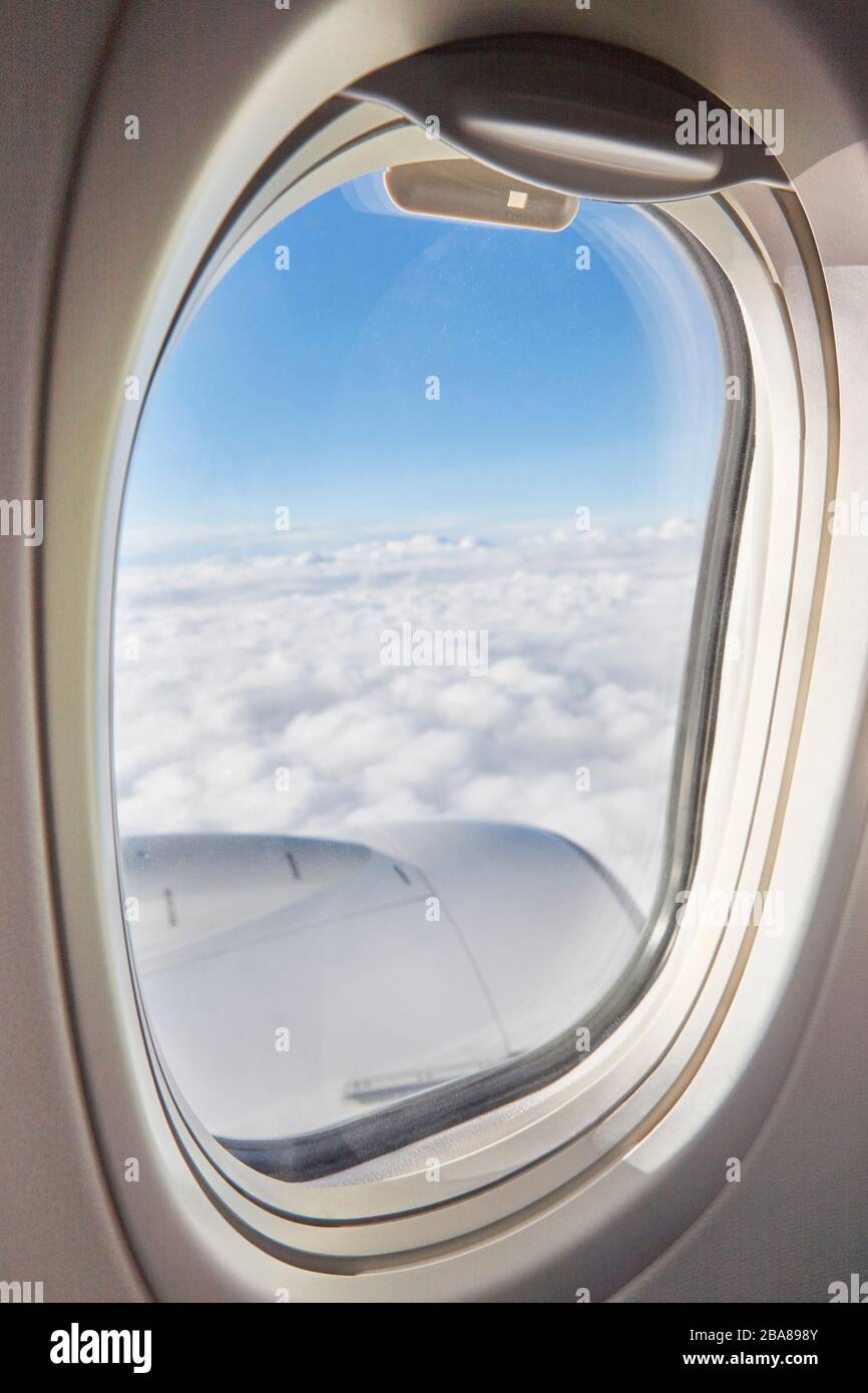 Open window with sky on a comercial aeroplane. Cabin interior. Vertical ...