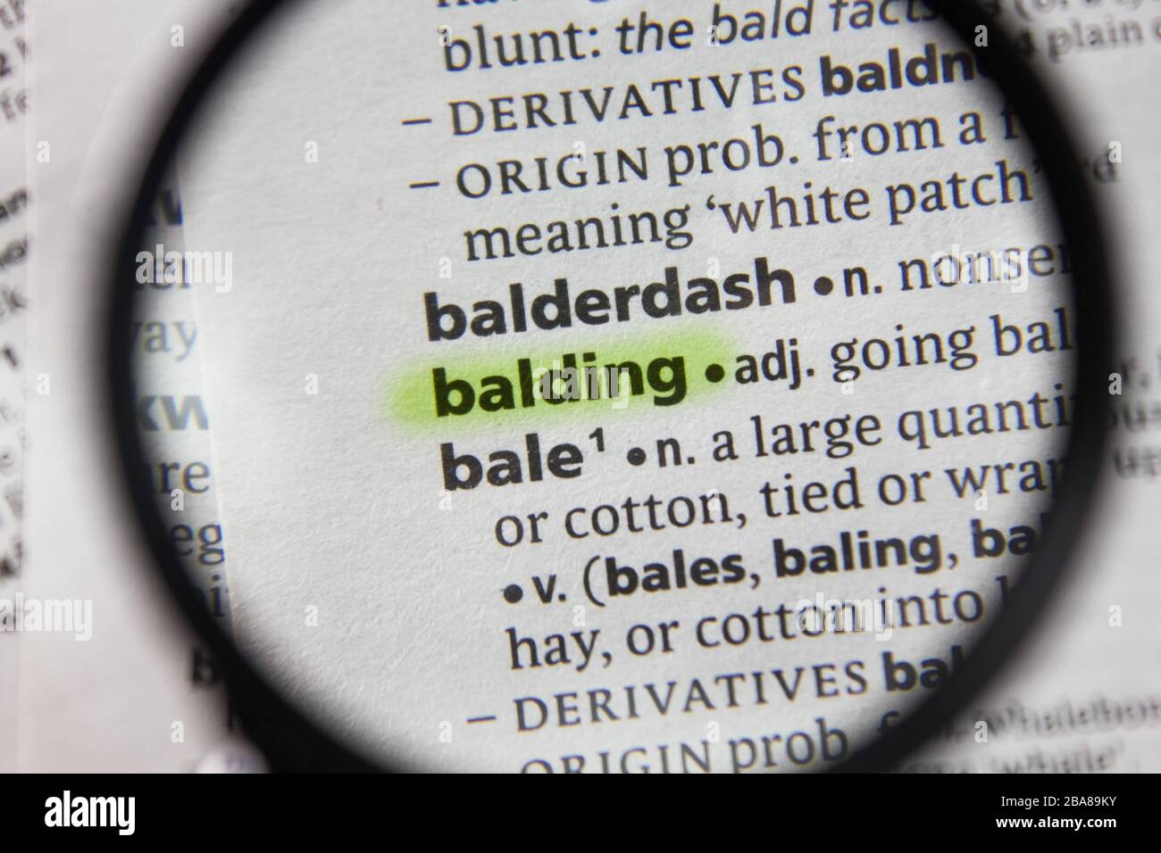 The word or phrase balding in a dictionary Stock Photo - Alamy