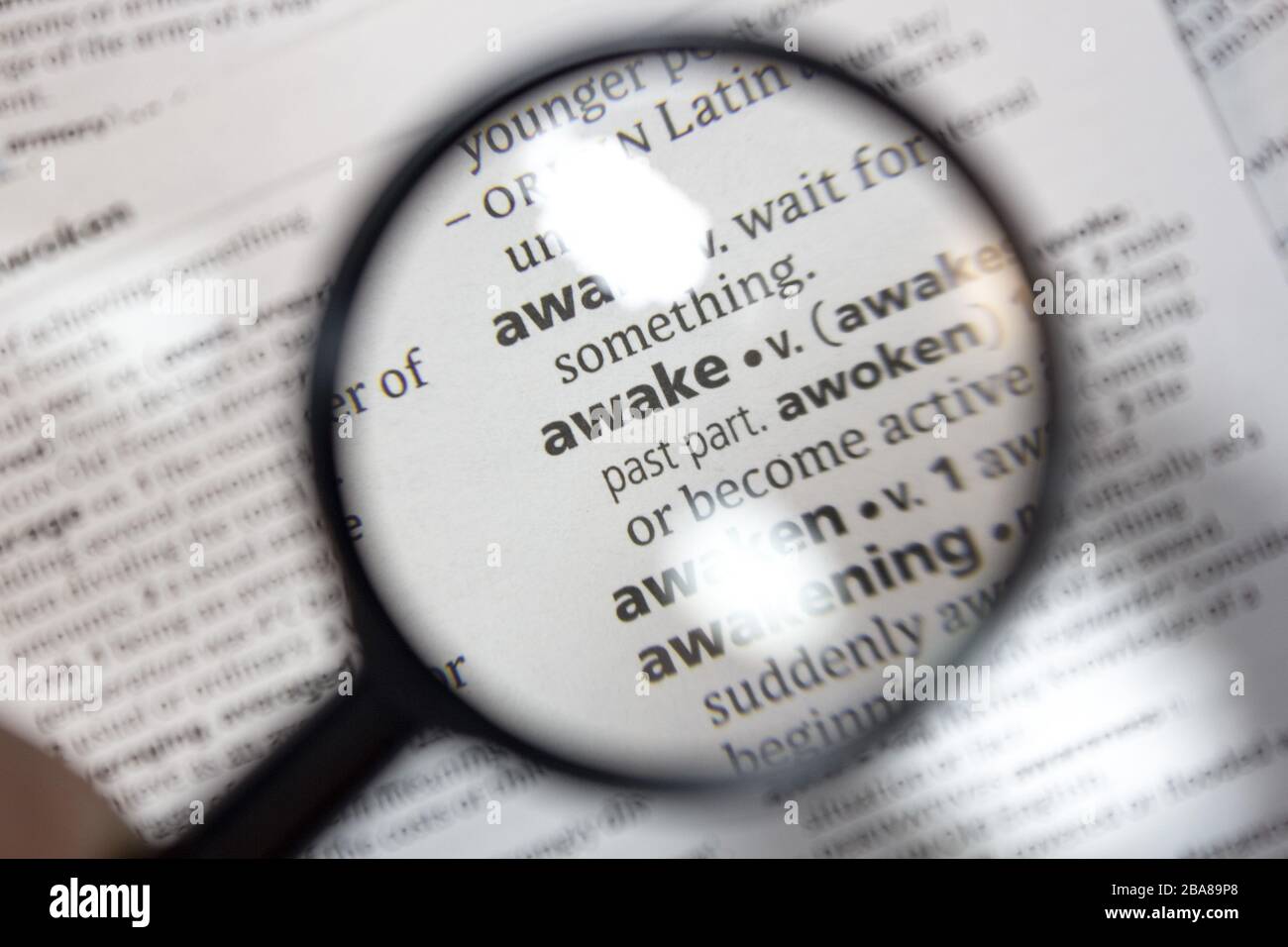 The word of phrase awake in a dictionary Stock Photo - Alamy