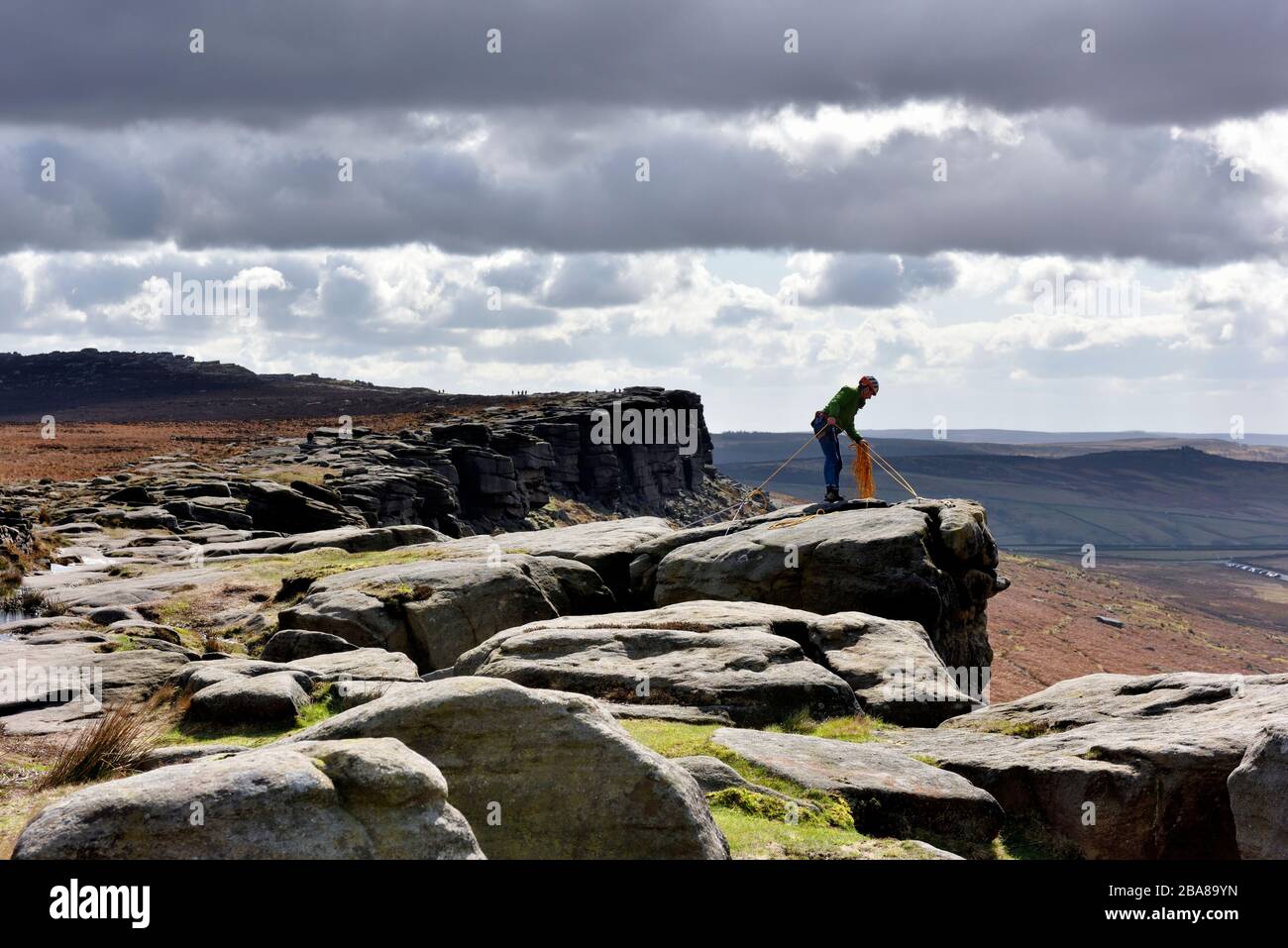 Rock Climber on the top of Stanage Edge in the Peak District, National ...