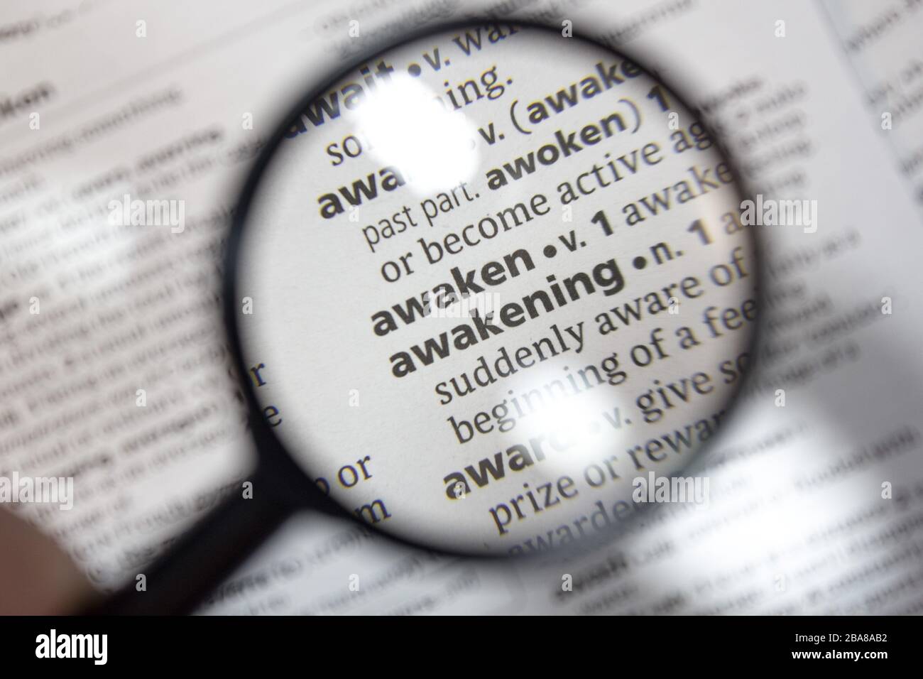 The word of phrase awaken and awakening in a dictionary Stock Photo - Alamy