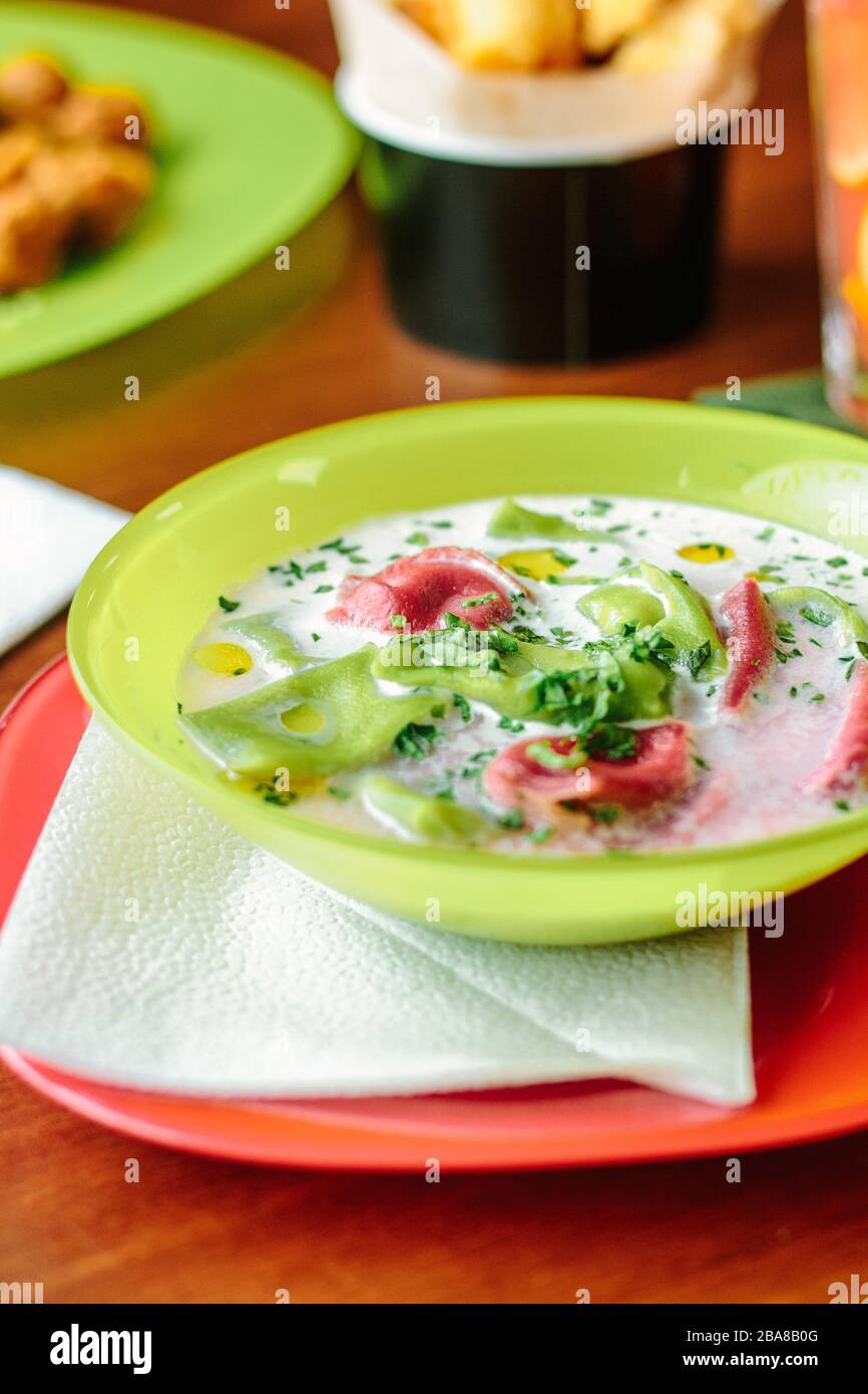 Green and red ravioli in soup for kids, great image for your needs ...