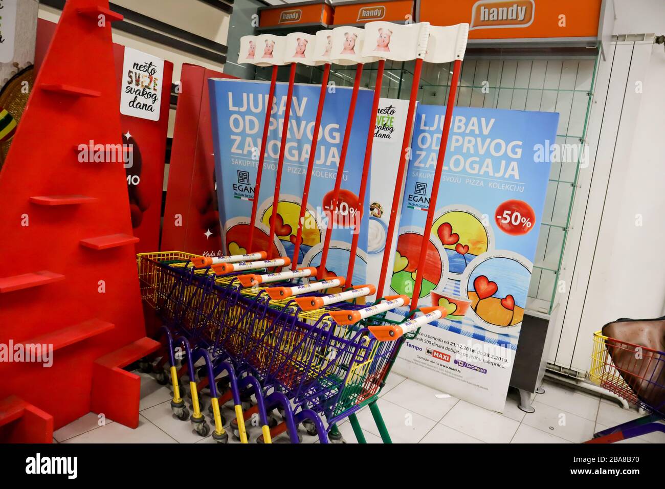 Nis,Serbia,March 08,2020: entrance to MAXI store, small shopping cart ...