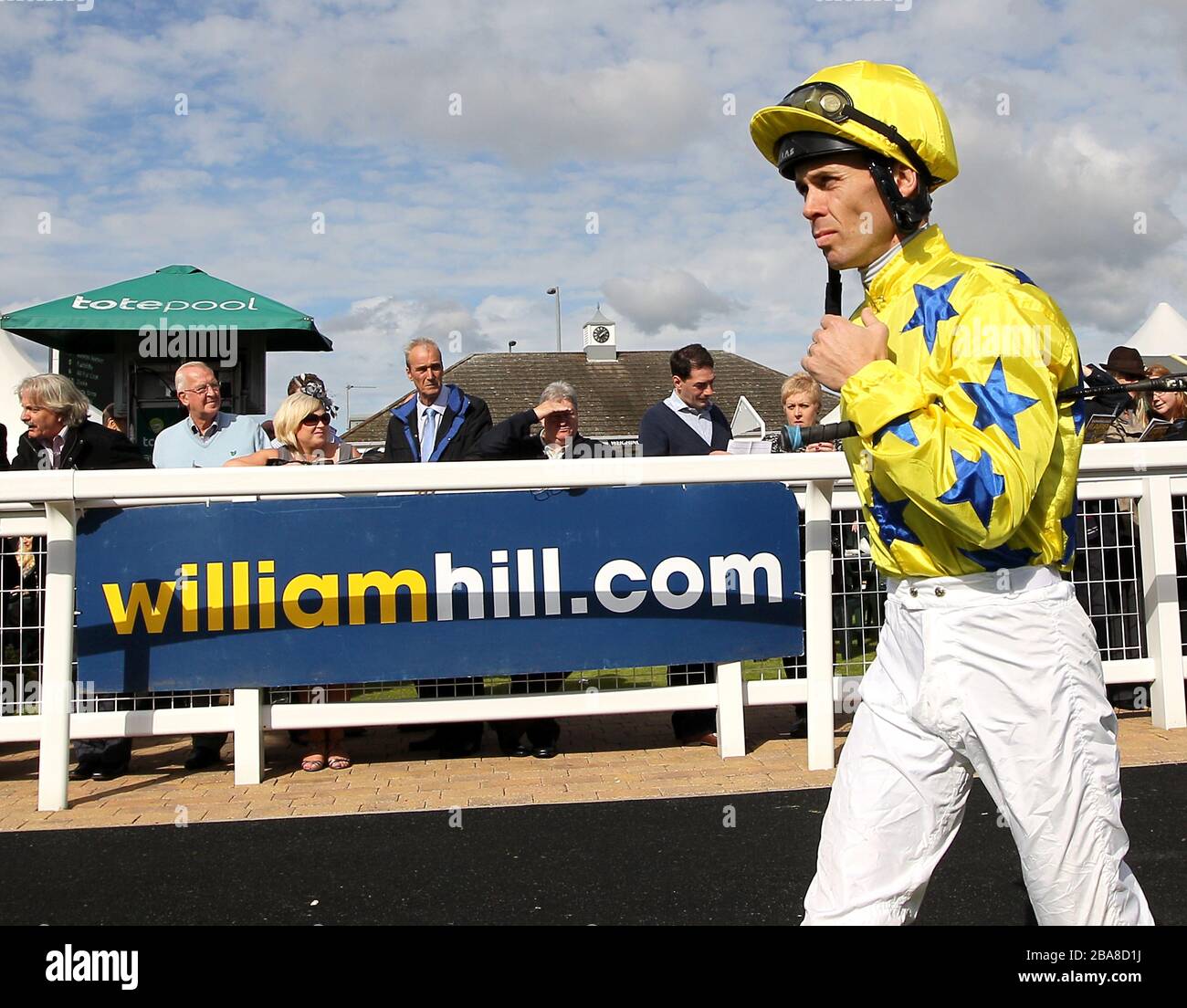 Jockey Graham Lee enters the parade ring before the Shadwell Stud Harry ...