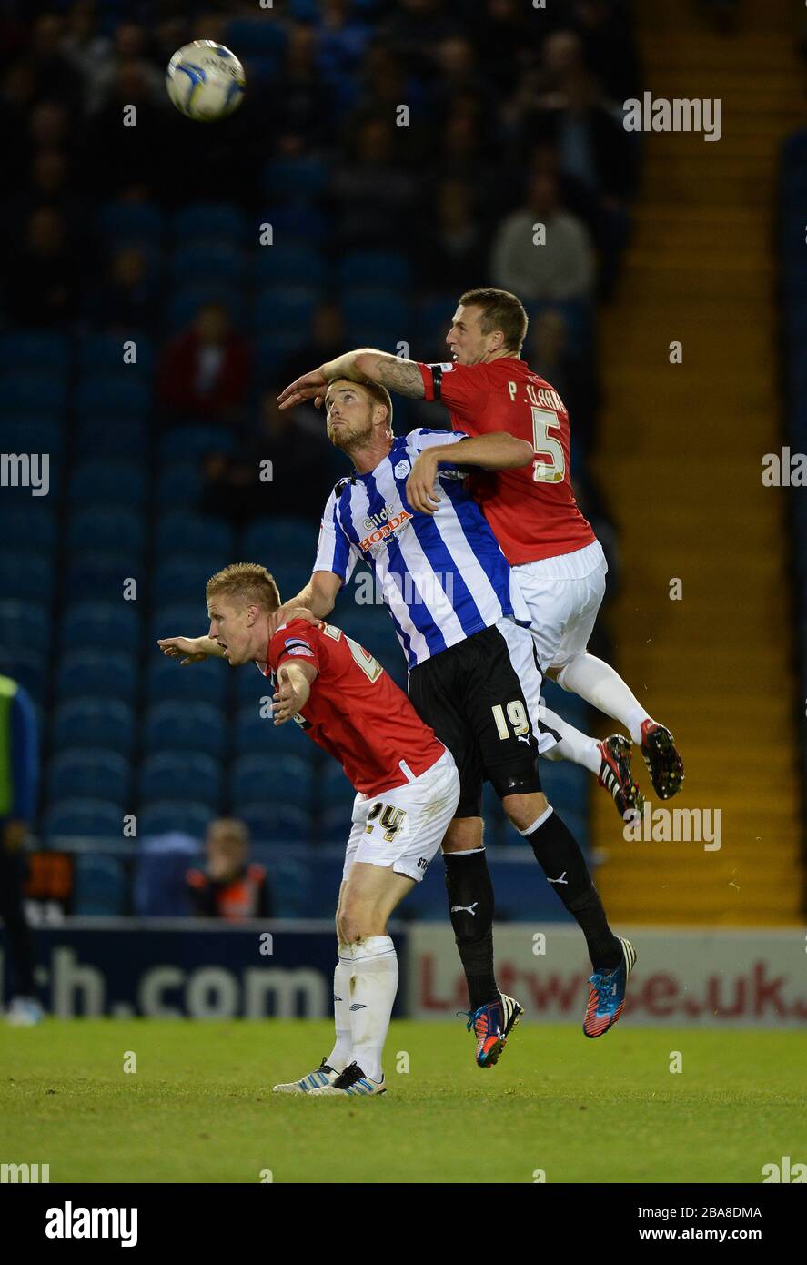 Sheffield Wednesday's Mark Beevers sandwiched between Huddersfield Town ...