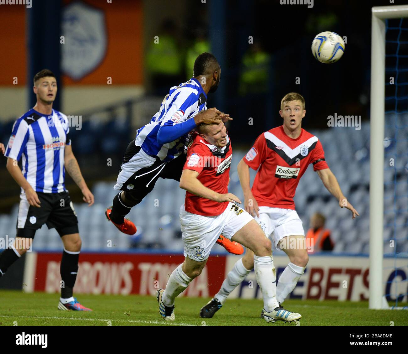 Sheffield Wednesday's Reda Johnson gets above Huddersfield Town's Keith ...