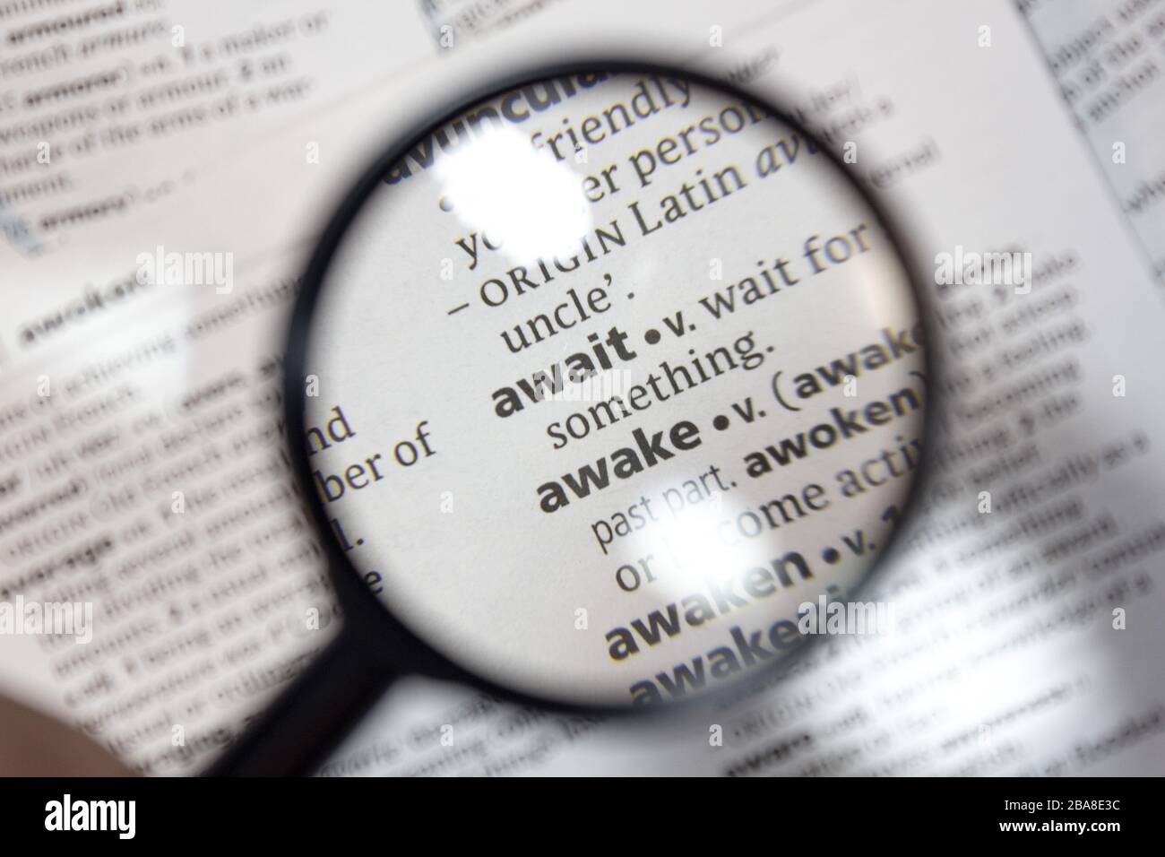 The word of phrase await in a dictionary Stock Photo - Alamy