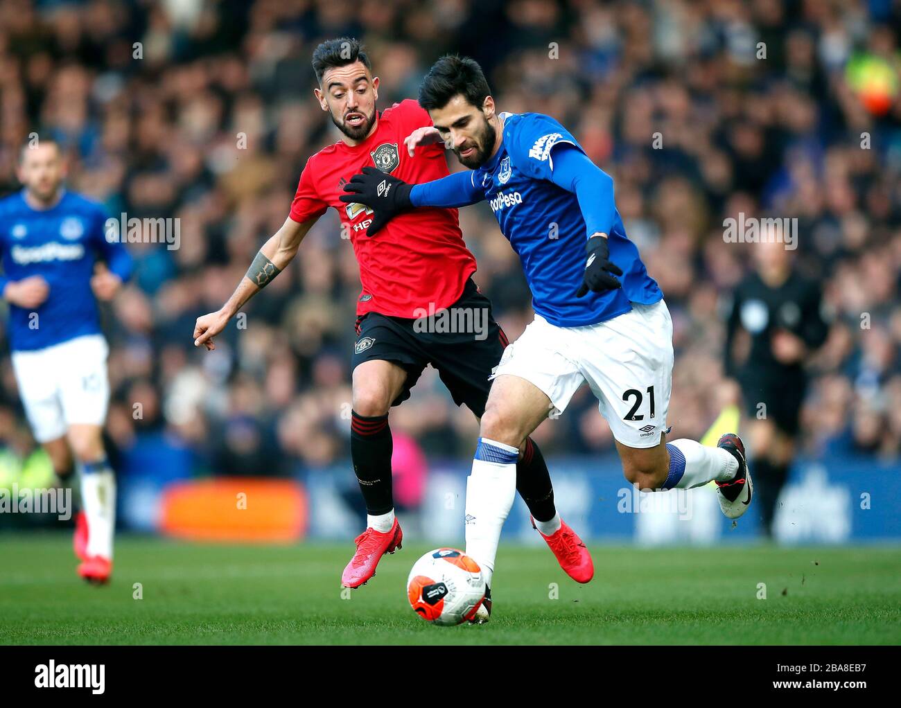 Manchester United's Bruno Fernandes (left) and Everton's Andre Gomes ...