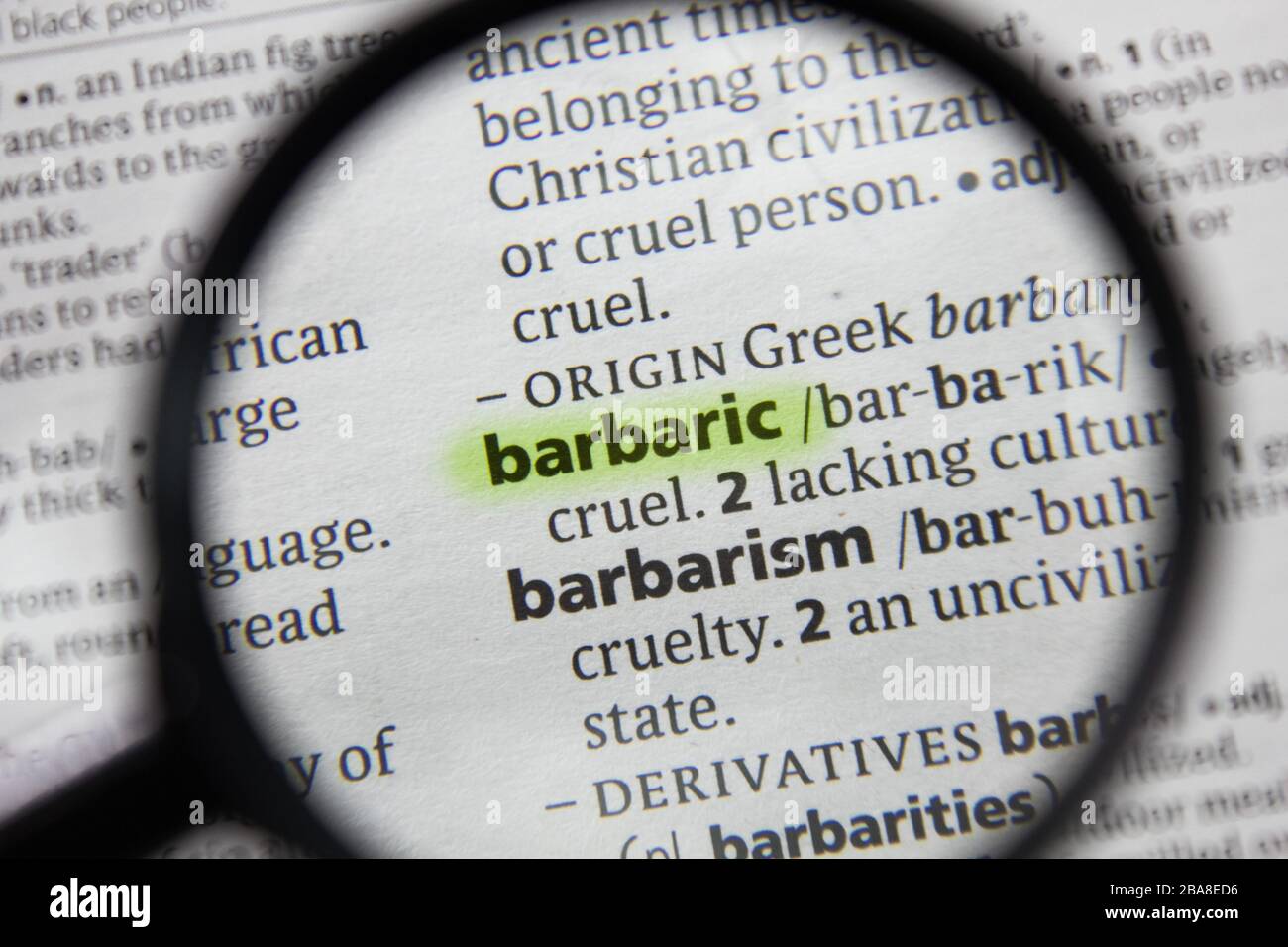 The word or phrase barbaric in a dictionary Stock Photo - Alamy
