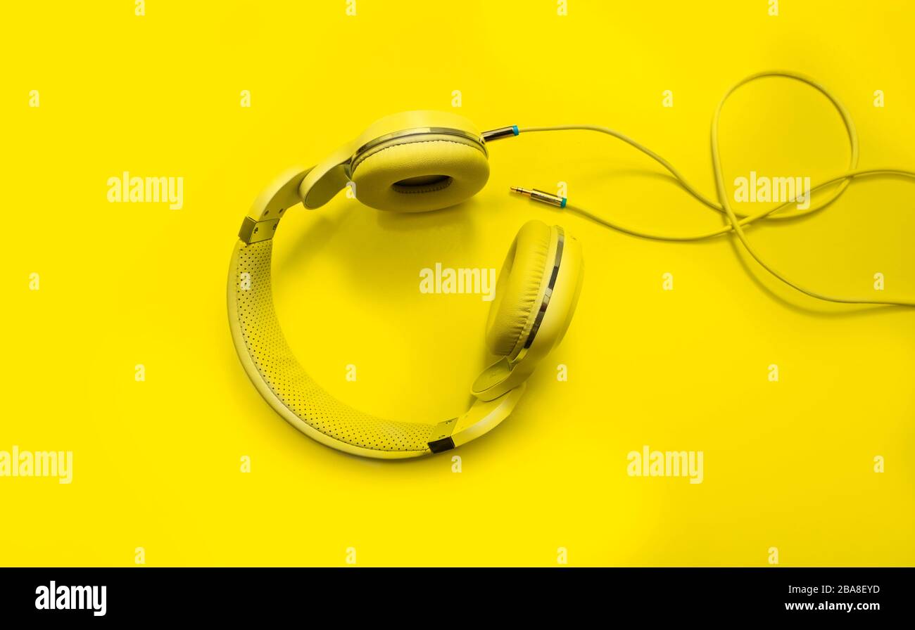 Top view yellow headphones and Convention Aux cable 3.5 mm with copy ...