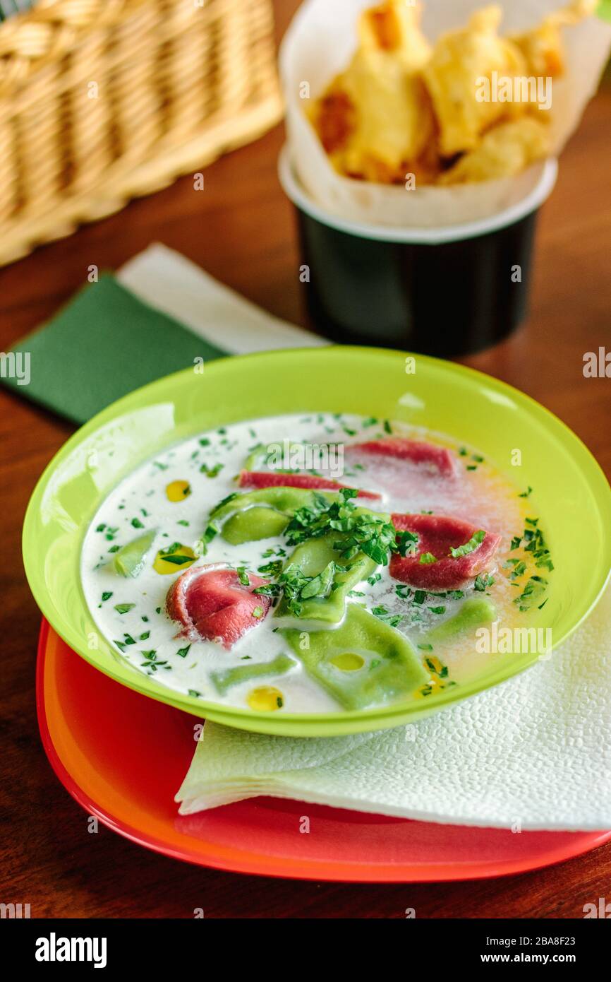 Green and red ravioli in soup for kids, great image for your needs ...