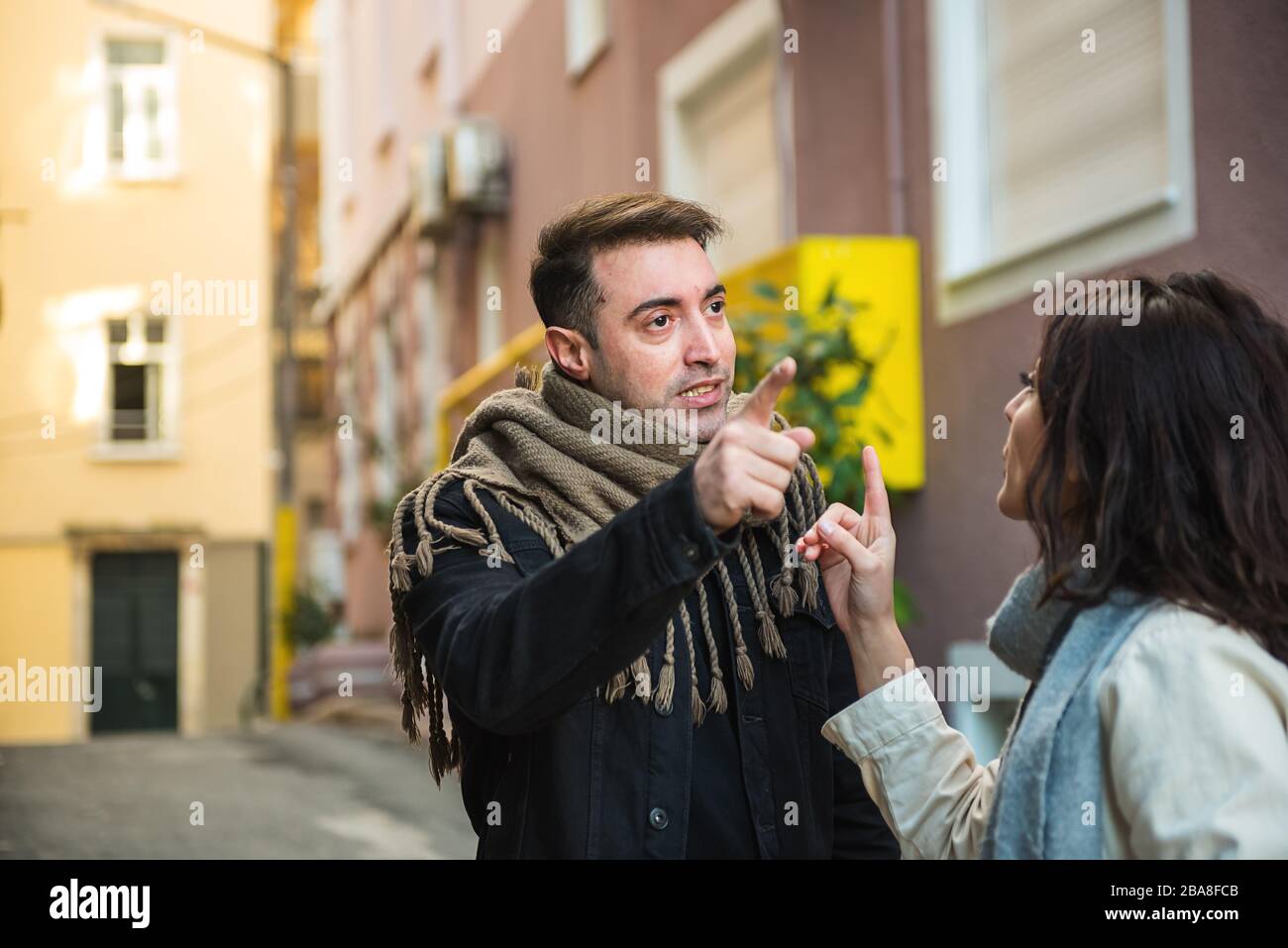 Couple having an argument and yelling to each other.Angry millennial ...